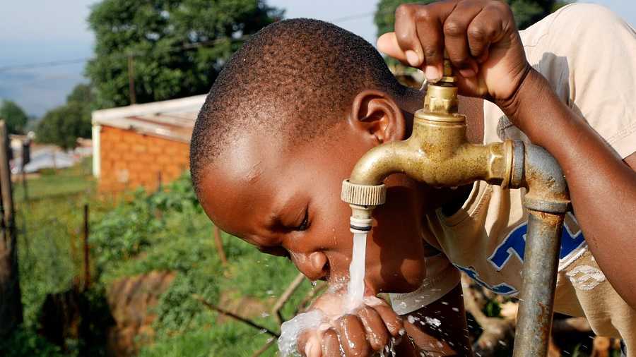 African-stock-video-of-a-rural-boy-opening-a-water-tap_compressed